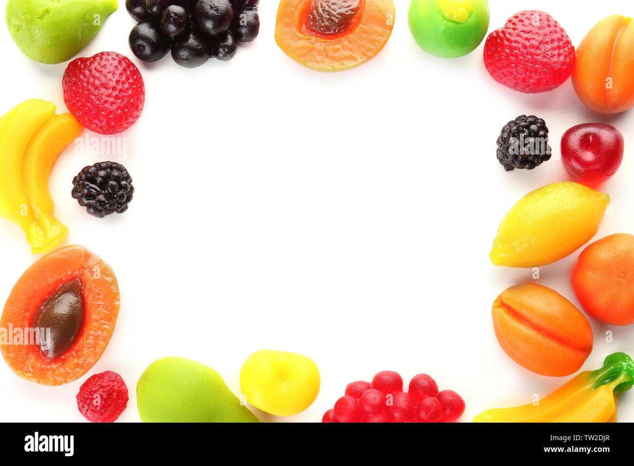 Frame made of fruit jelly candies on white background Stock Photo - Alamy
