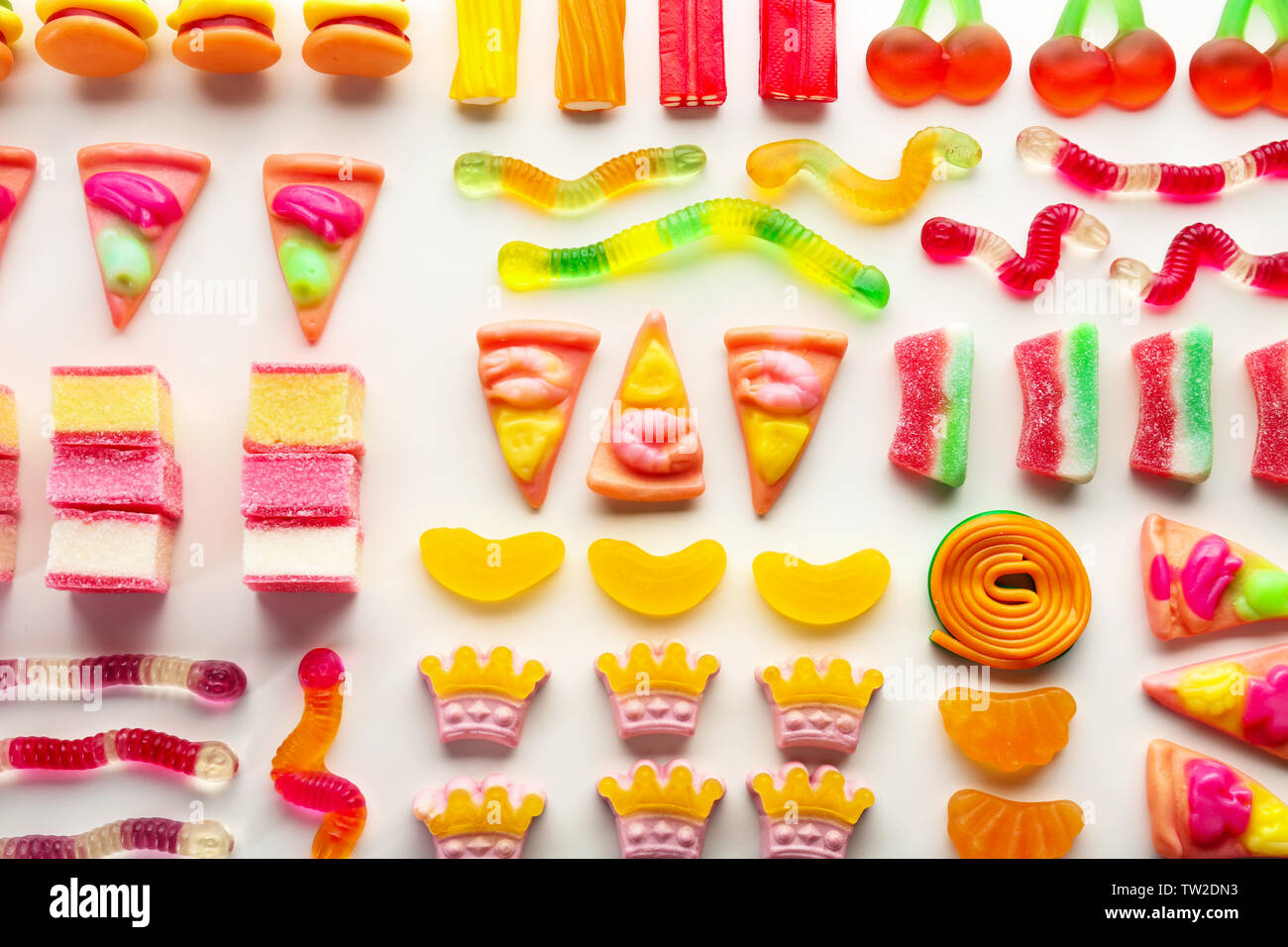 Composition of colorful jelly candies on white background Stock Photo ...