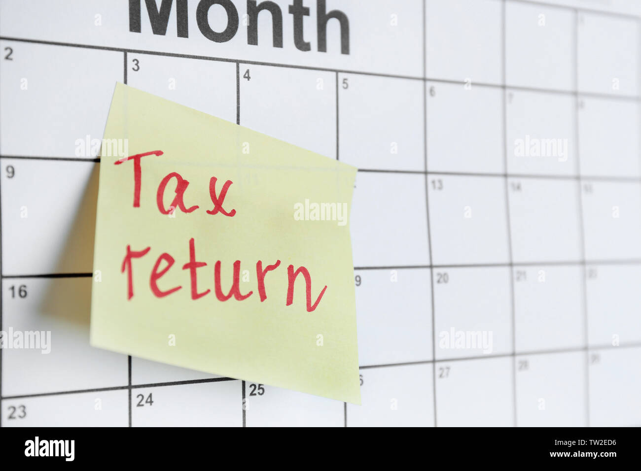 Note with text and calendar. Tax return concept Stock Photo - Alamy