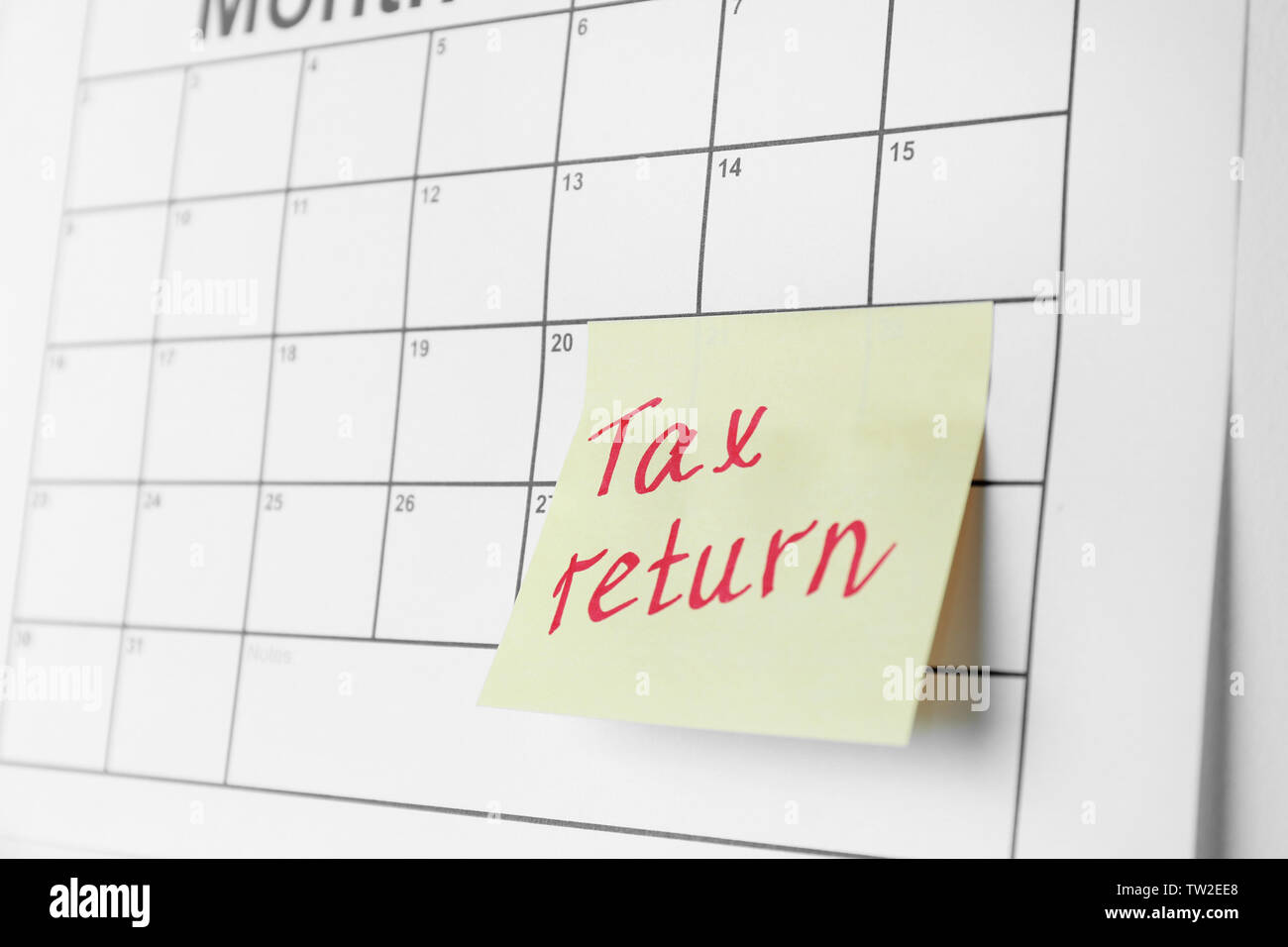 Note with text and calendar. Tax return concept Stock Photo - Alamy