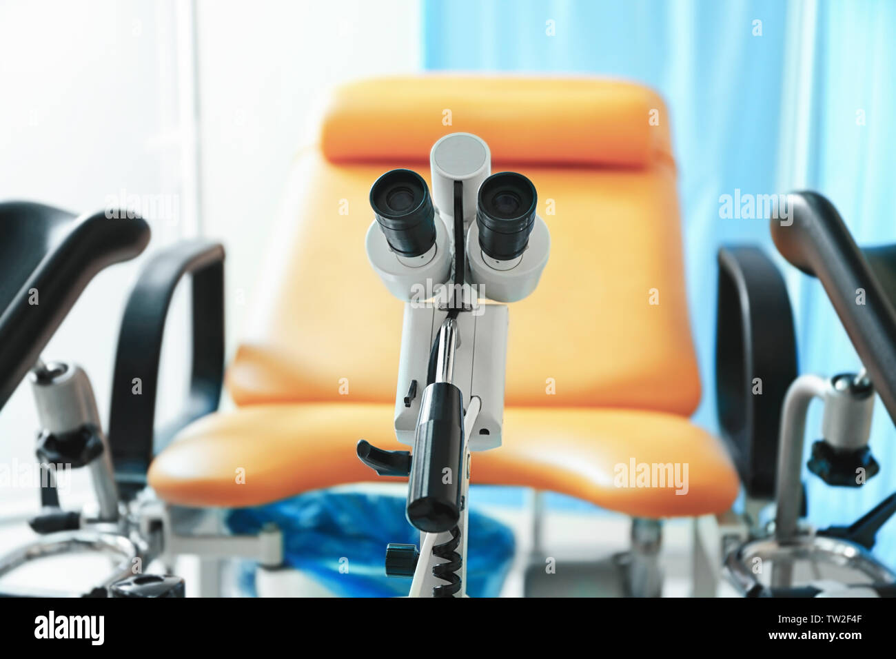 Colposcope in gynecological room and blurred chair on background Stock ...