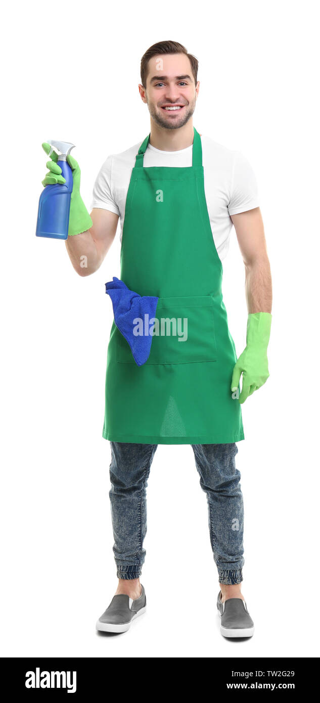 Cleaning concept. Young man in green apron holding cleanser on white ...