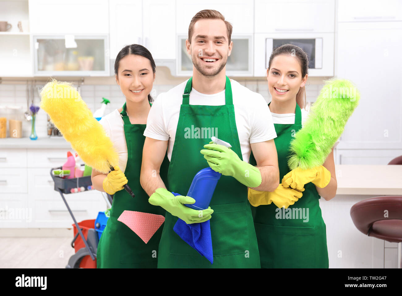 Cleaning service team at work in kitchen Stock Photo - Alamy