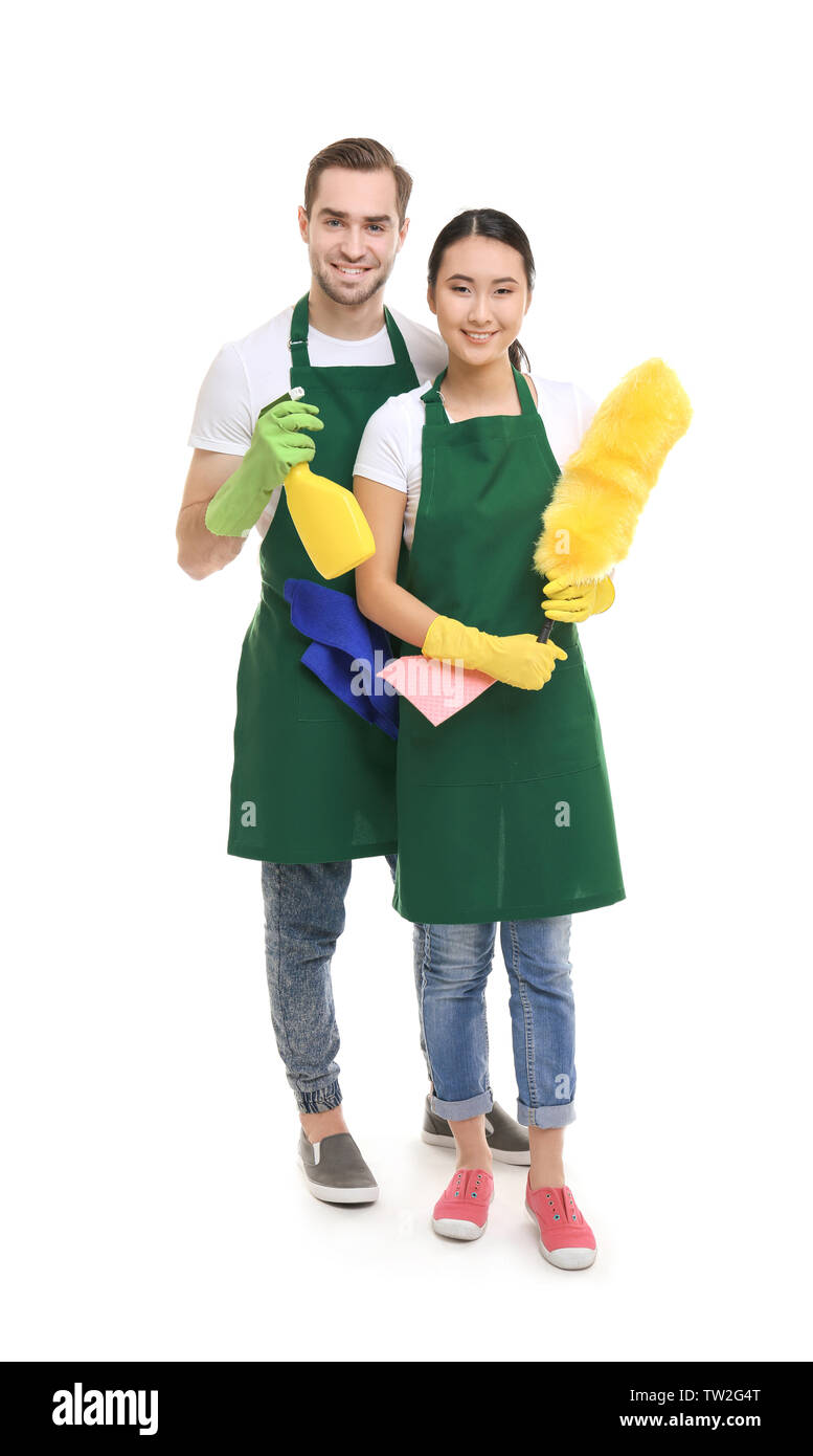 Cleaning service team in green aprons on white background Stock Photo ...