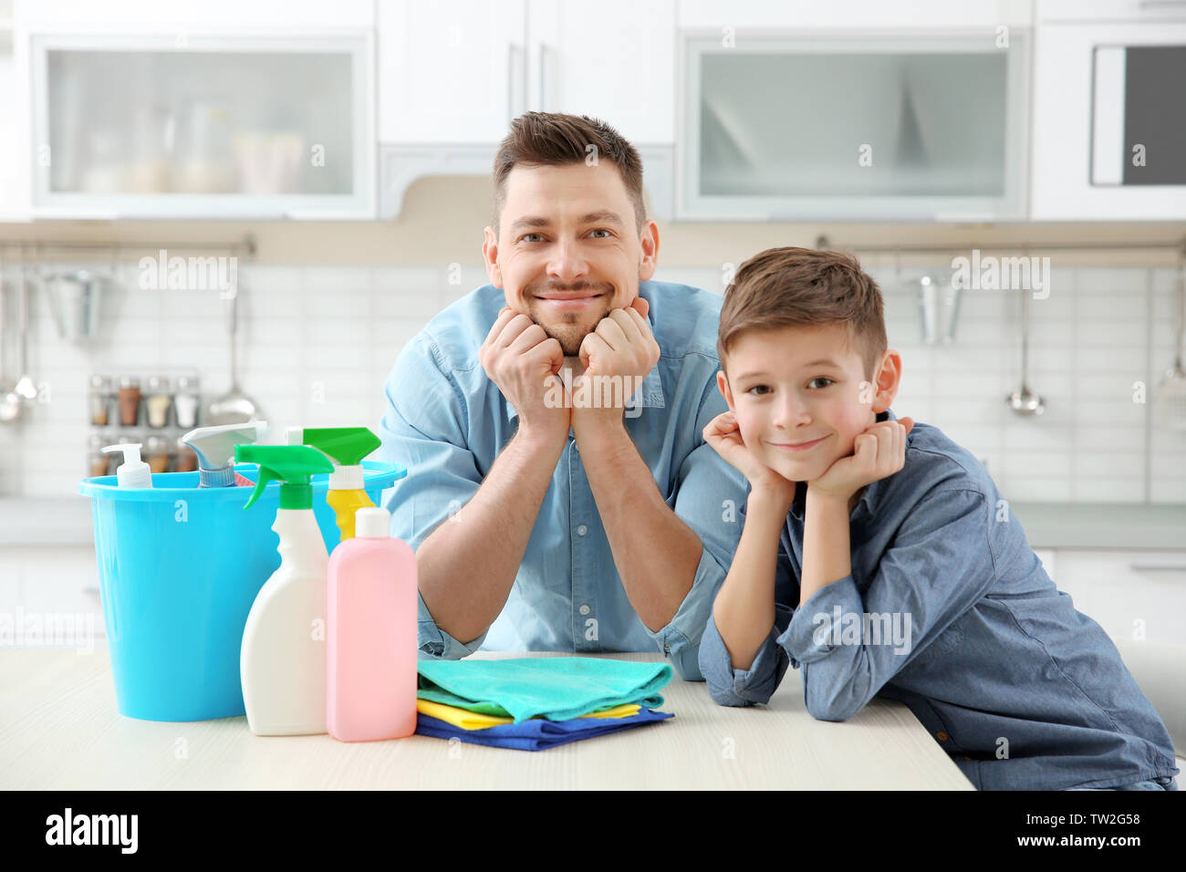 Dad and son preparing to do cleaning at home Stock Photo - Alamy