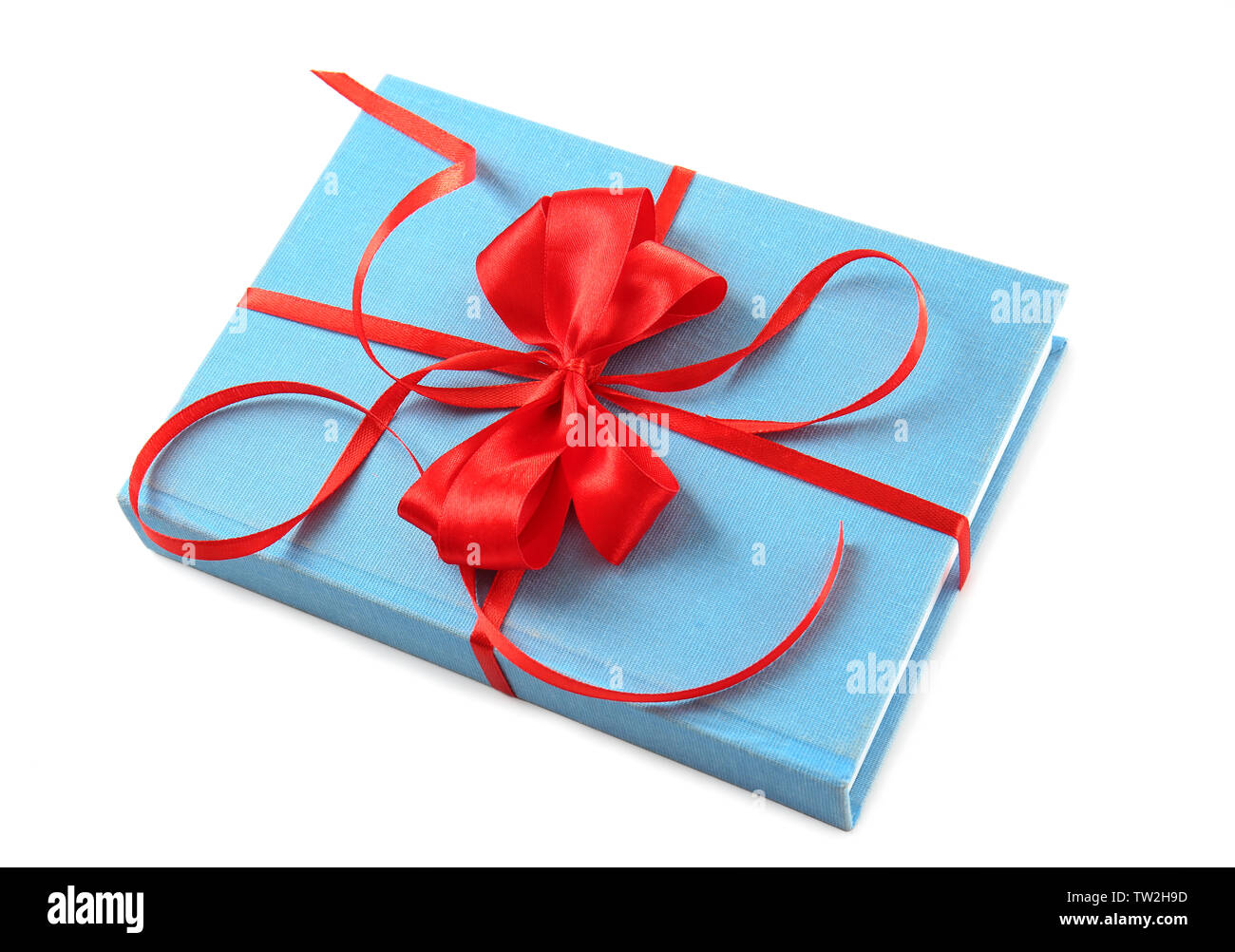 Book with ribbon as gift on white background Stock Photo - Alamy
