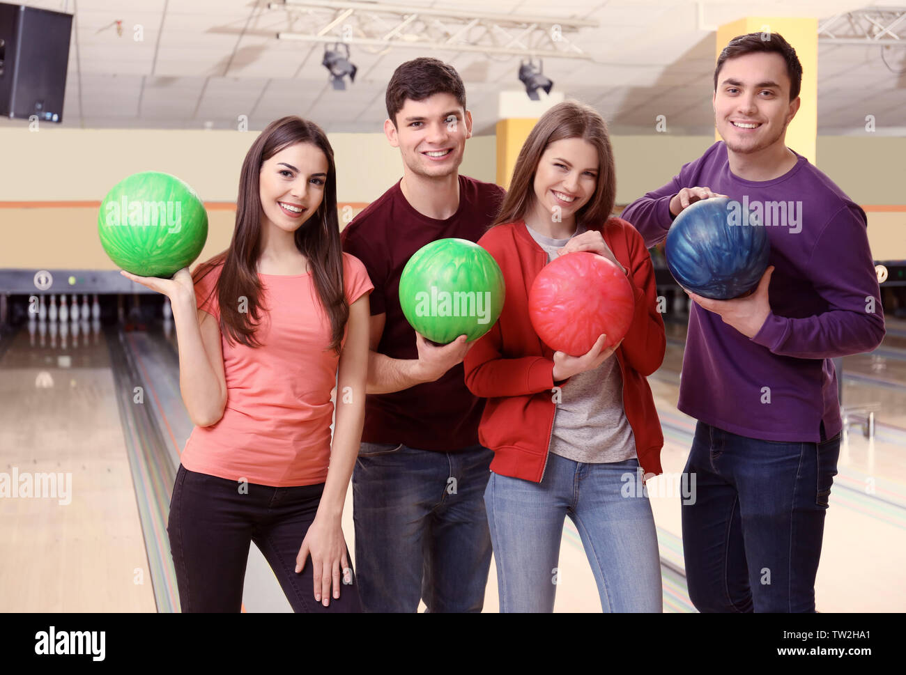 Friends having fun at bowling club Stock Photo - Alamy