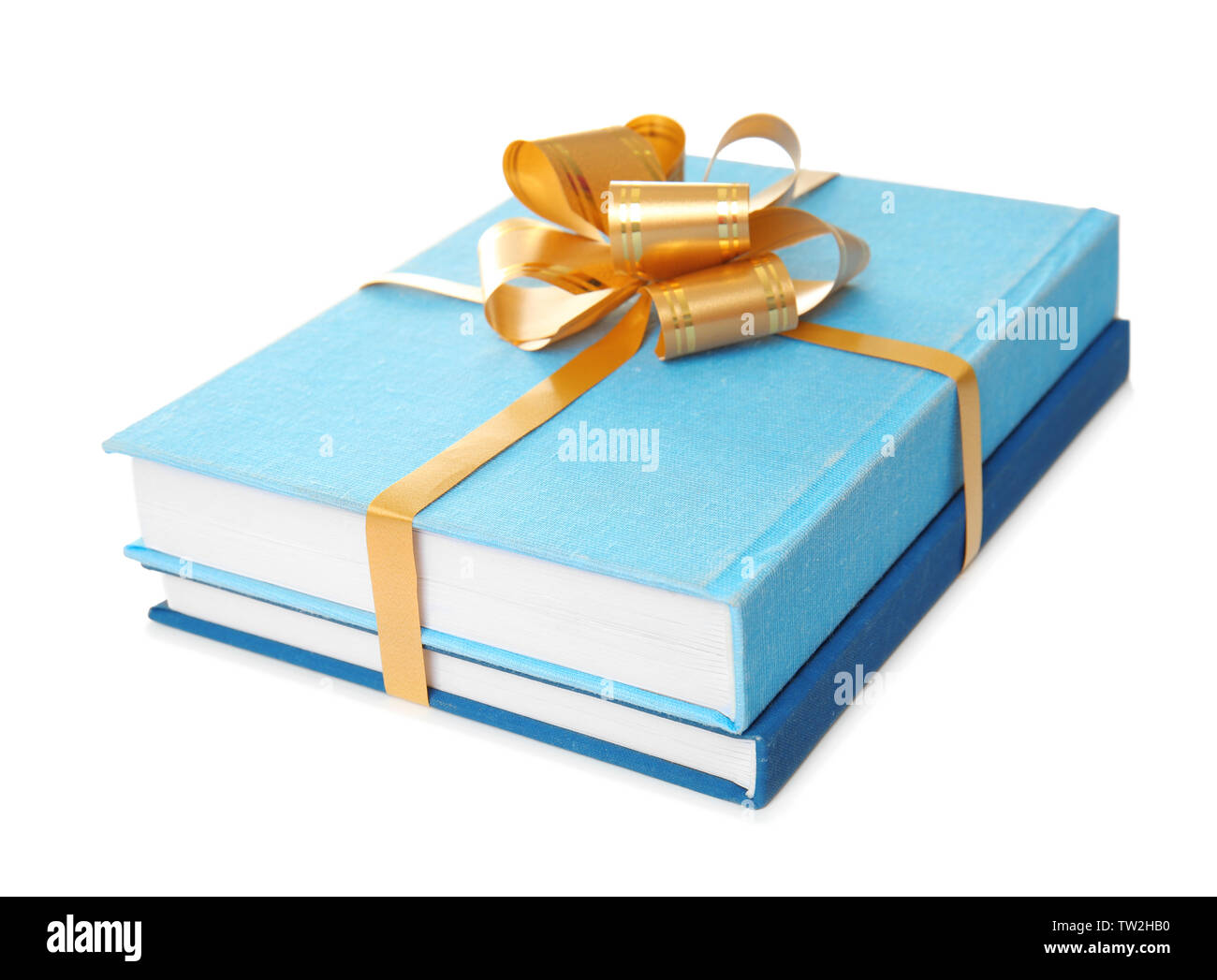 Two books with ribbon as gift on white background Stock Photo - Alamy