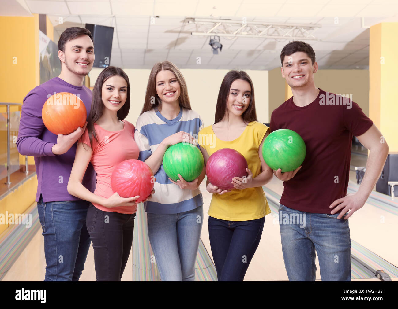 Friends having fun at bowling club Stock Photo - Alamy