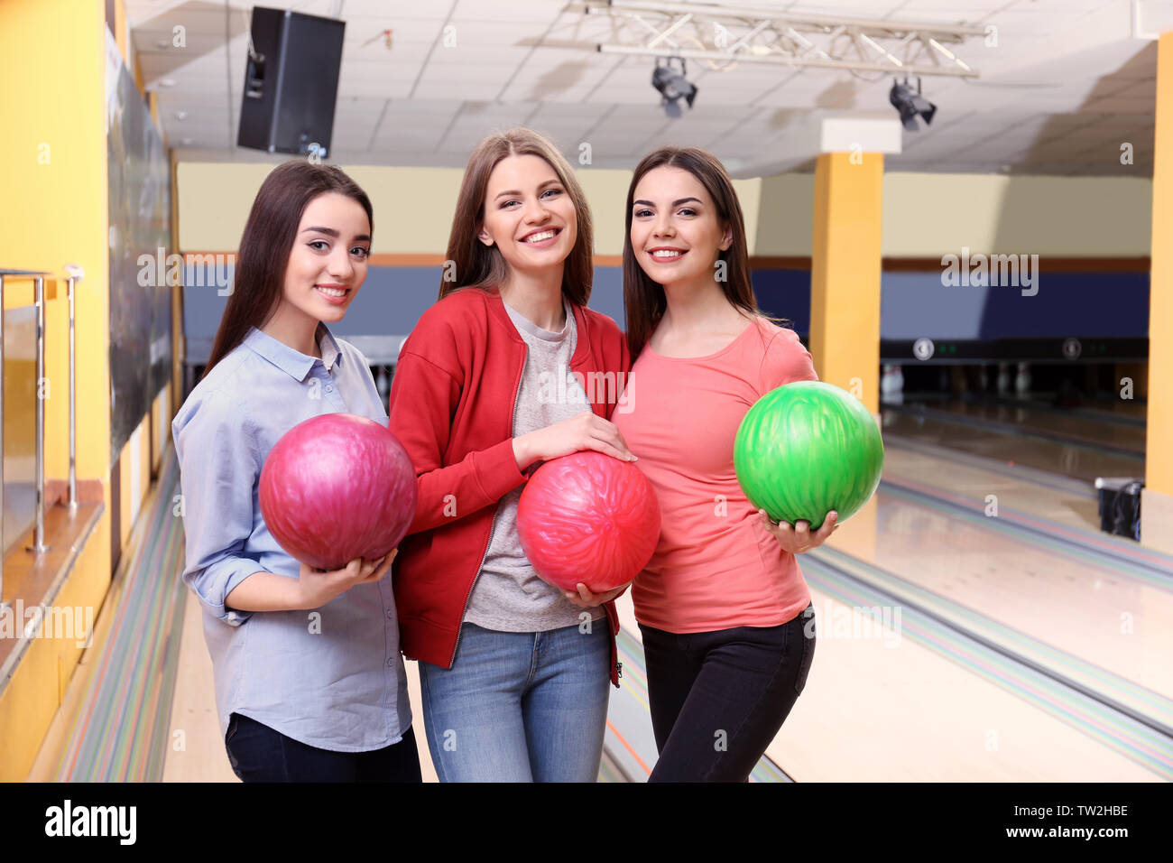 Friends having fun at bowling club Stock Photo - Alamy