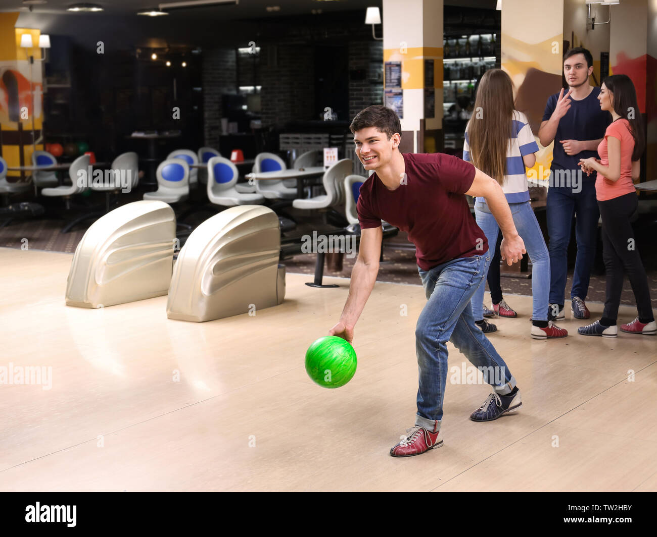 Happy group people bowling having hi-res stock photography and images ...
