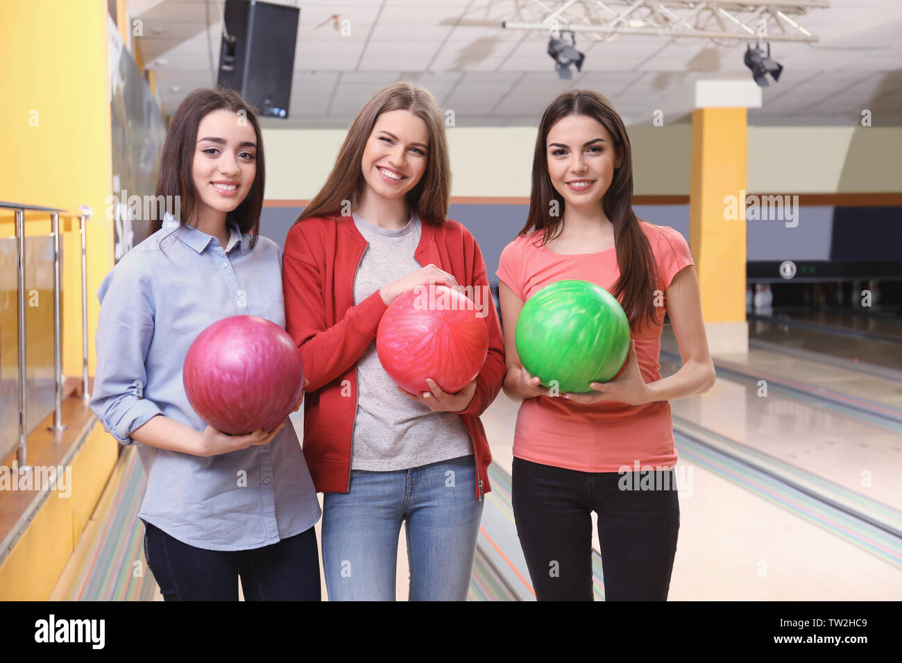 Friends having fun at bowling club Stock Photo - Alamy