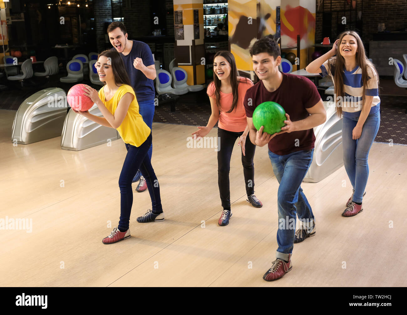 Friends having fun at bowling club Stock Photo - Alamy