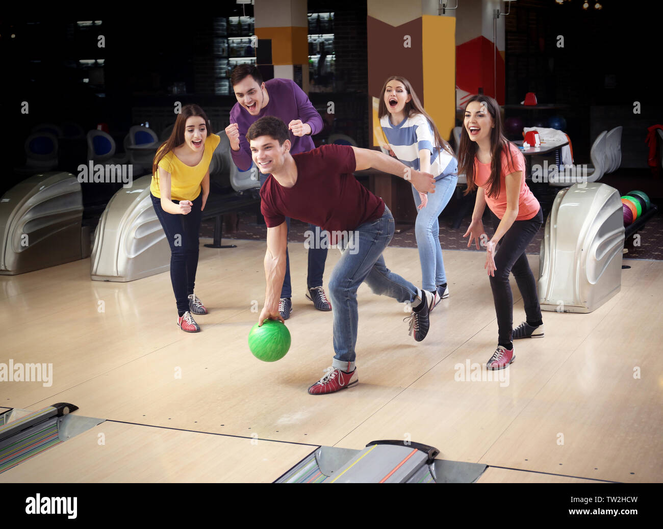 Friends having fun at bowling club Stock Photo - Alamy