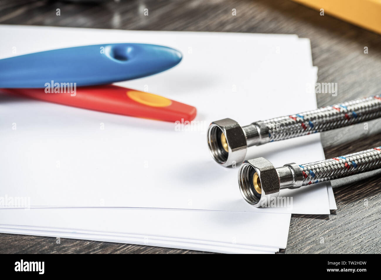 Water fittings and connections with segments of braided hose. Close up ...