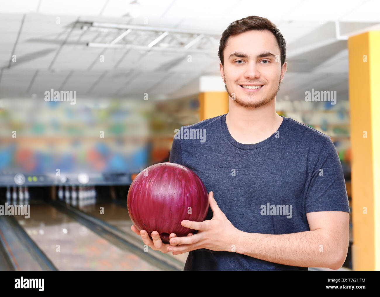 Happy man bowling ball hi-res stock photography and images - Alamy