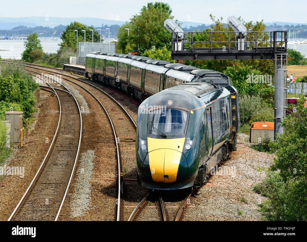 A British Rail class 800 bi-mode multiple unit leaves the platform loop at Dawlish Warren ...