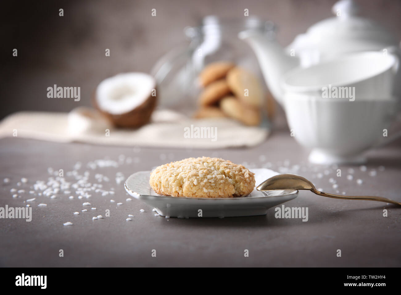 Delicious coconut cookie covered with flakes on saucer Stock Photo - Alamy