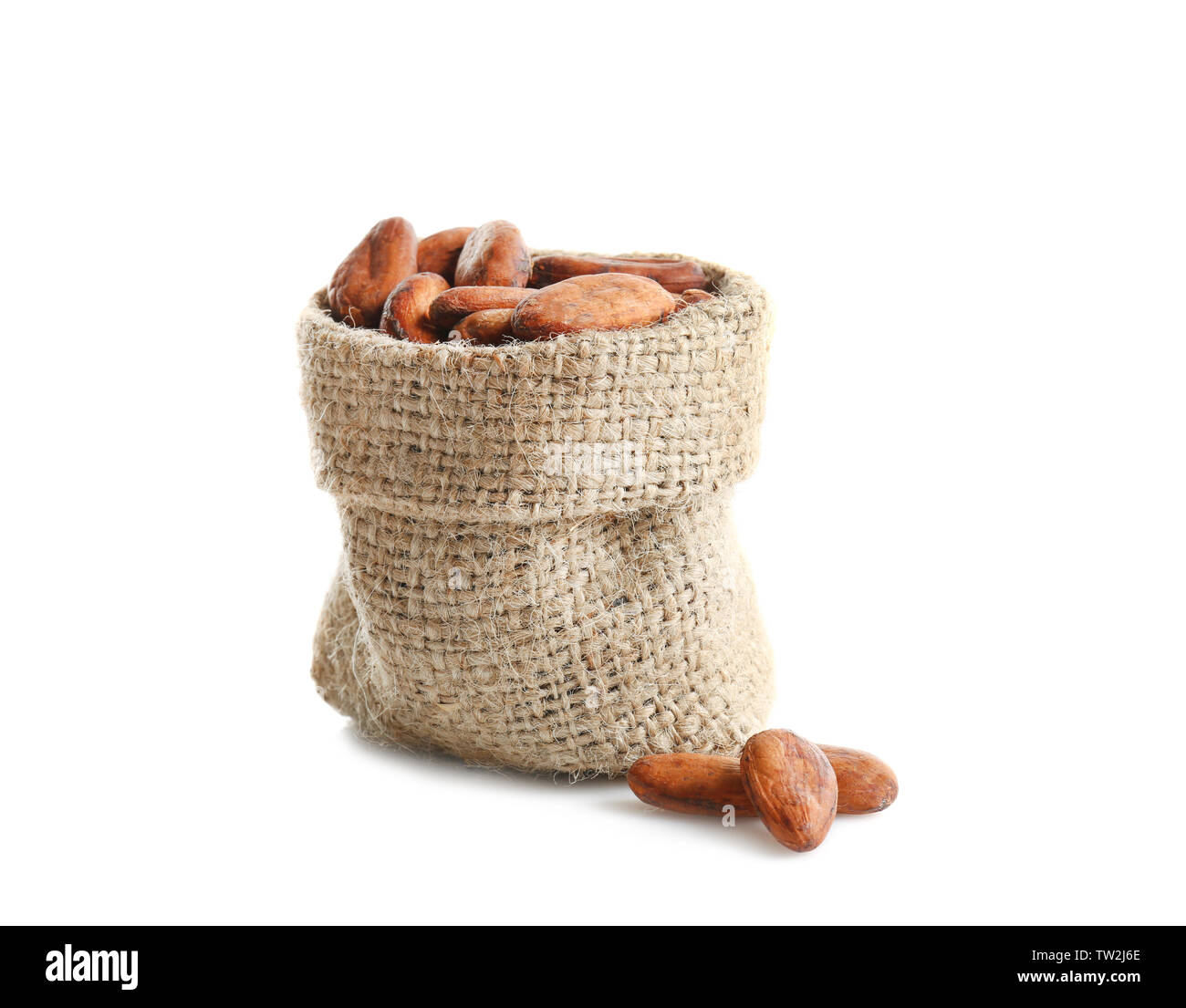 Burlap sack with aromatic cocoa beans on white background Stock Photo ...