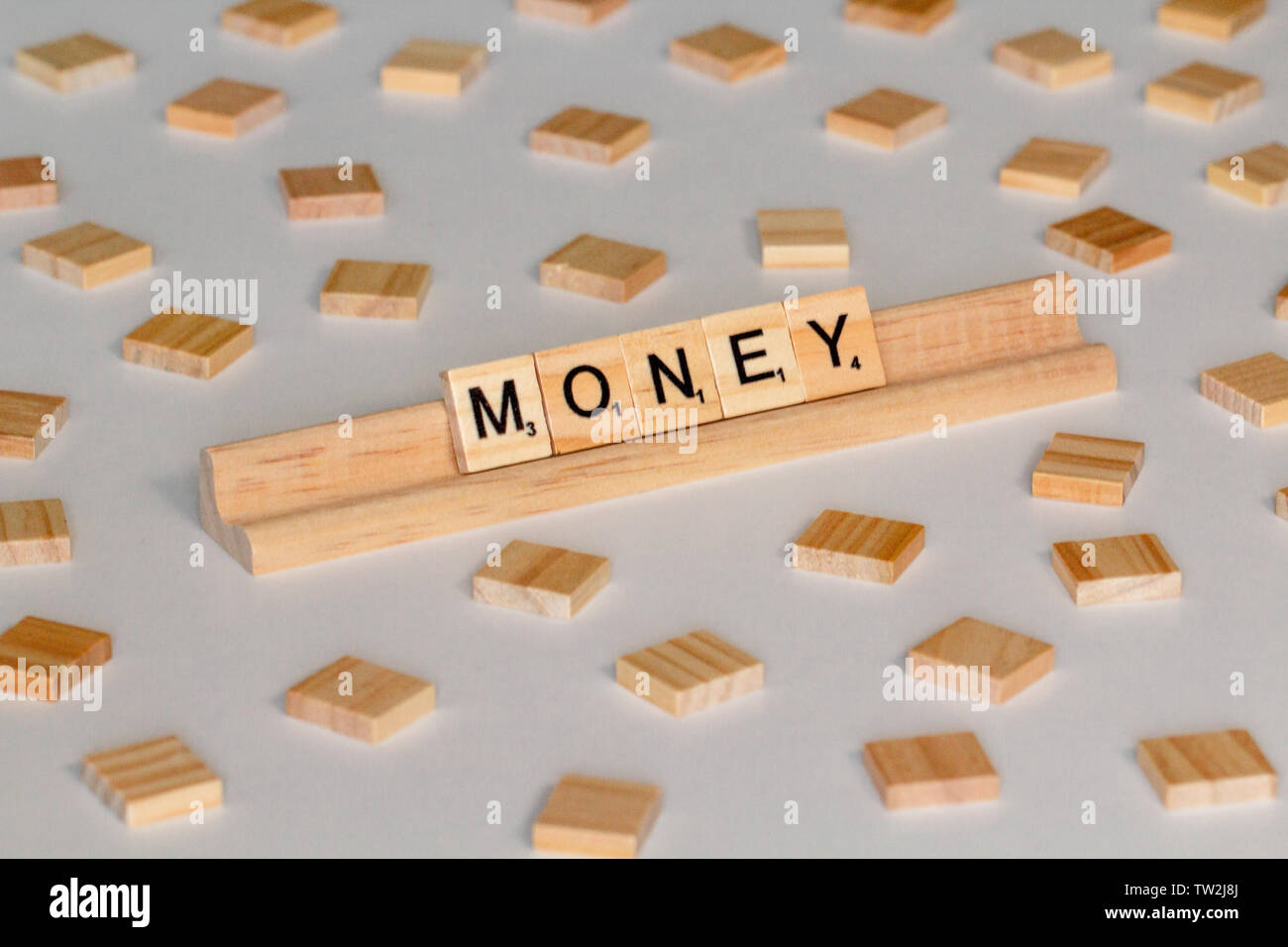 Scrabble Word Game wood tiles spelling "Money Stock Photo - Alamy