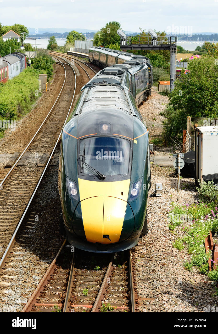 A British Rail class 800 bi-mode multiple unit leaves the platform loop ...