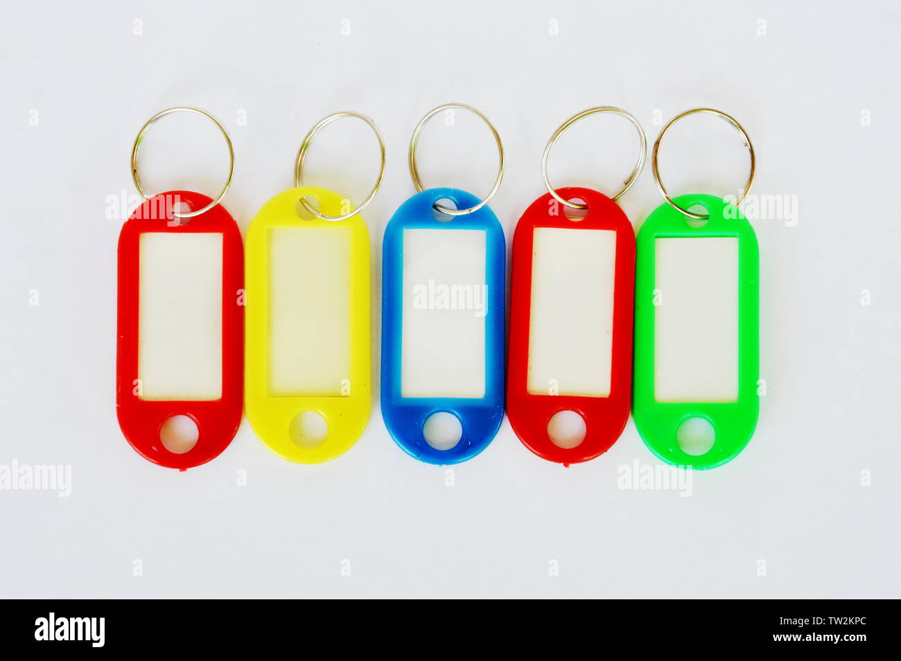 colorful plastic name tag on white background Stock Photo - Alamy