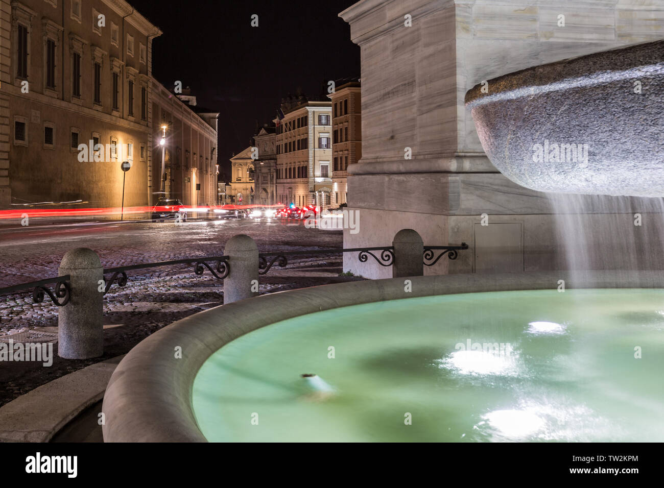 An illuminated fountain in Rome at night with light trails Stock Photo ...