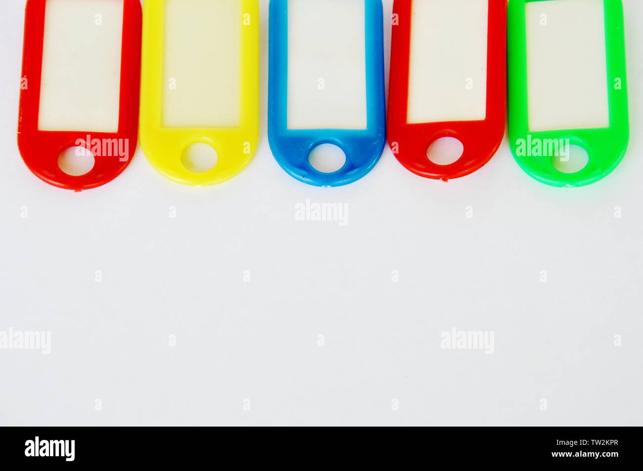 colorful plastic name tag on white background Stock Photo - Alamy