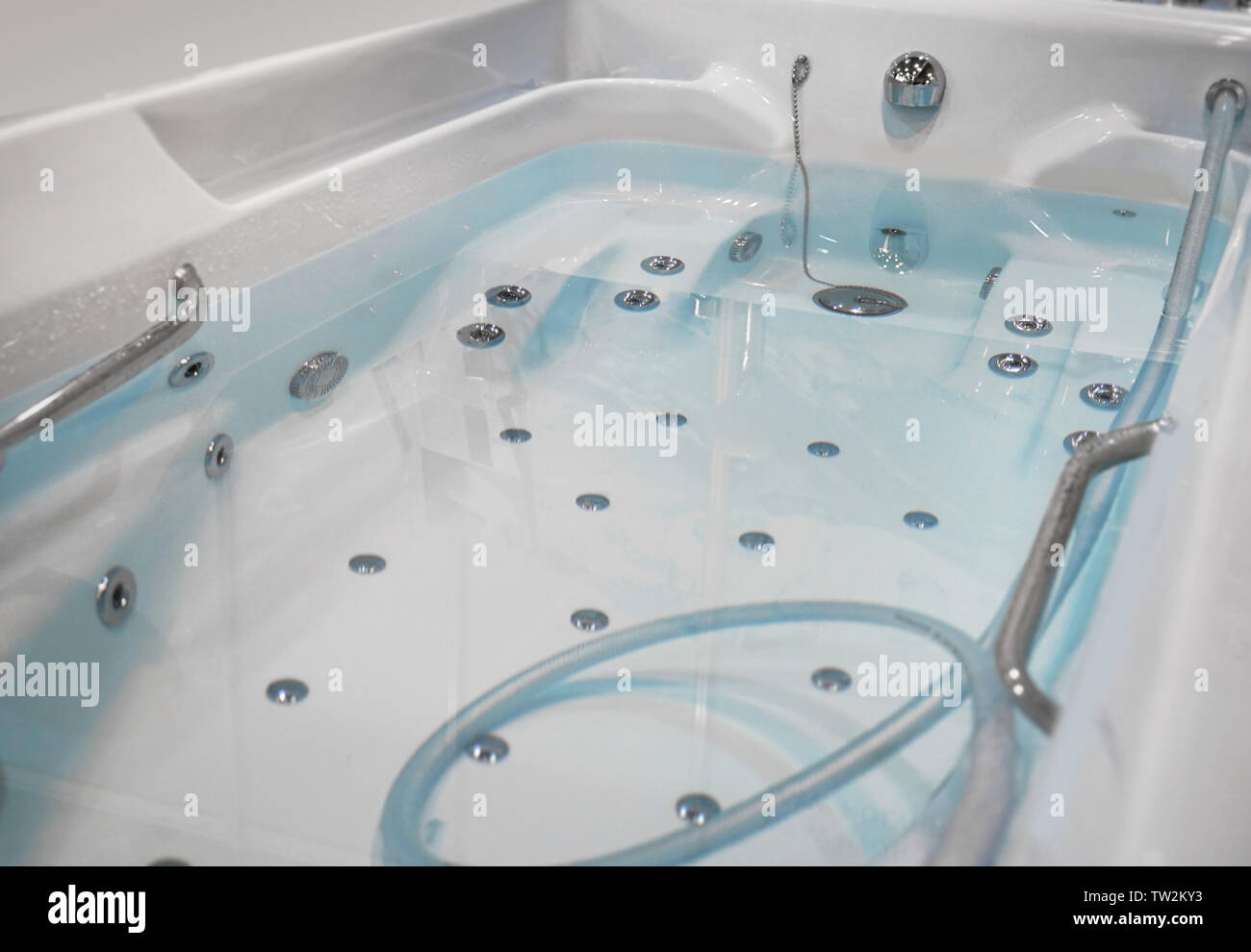 Jacuzzi bath in modern spa center Stock Photo - Alamy