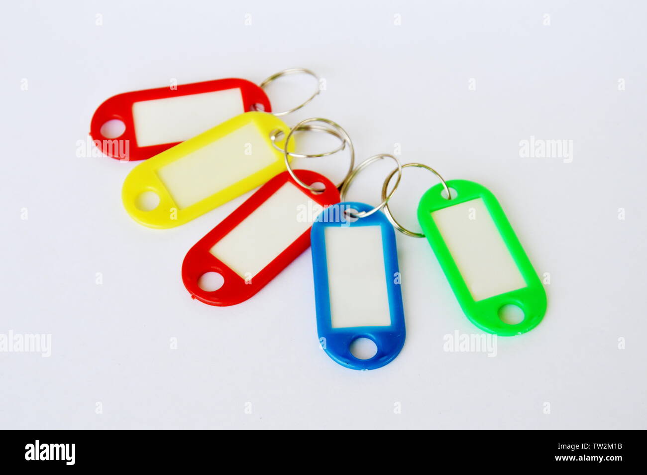 colorful plastic name tag on white background Stock Photo - Alamy