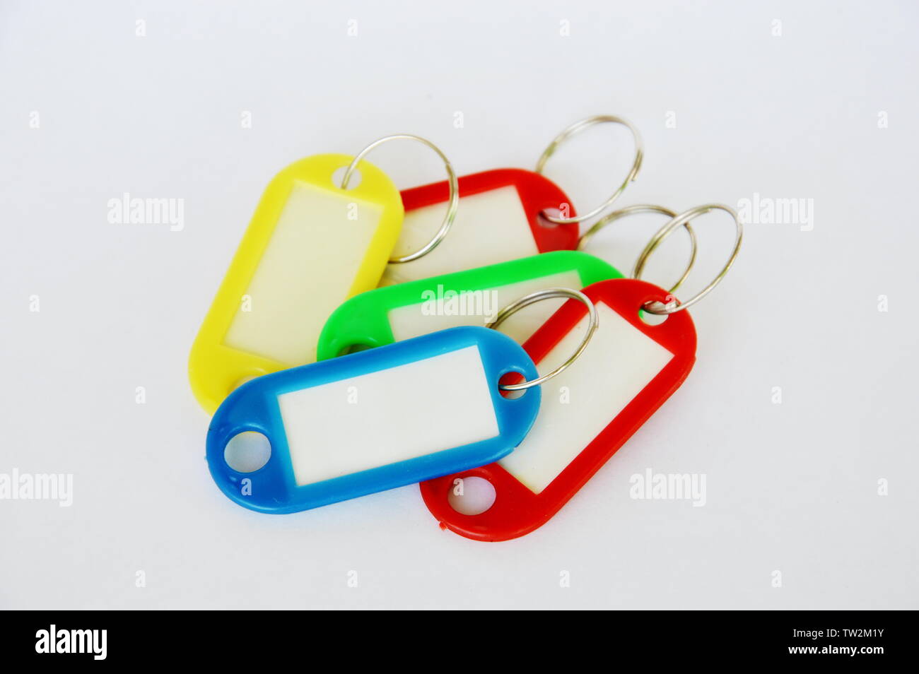 colorful plastic name tag on white background Stock Photo - Alamy