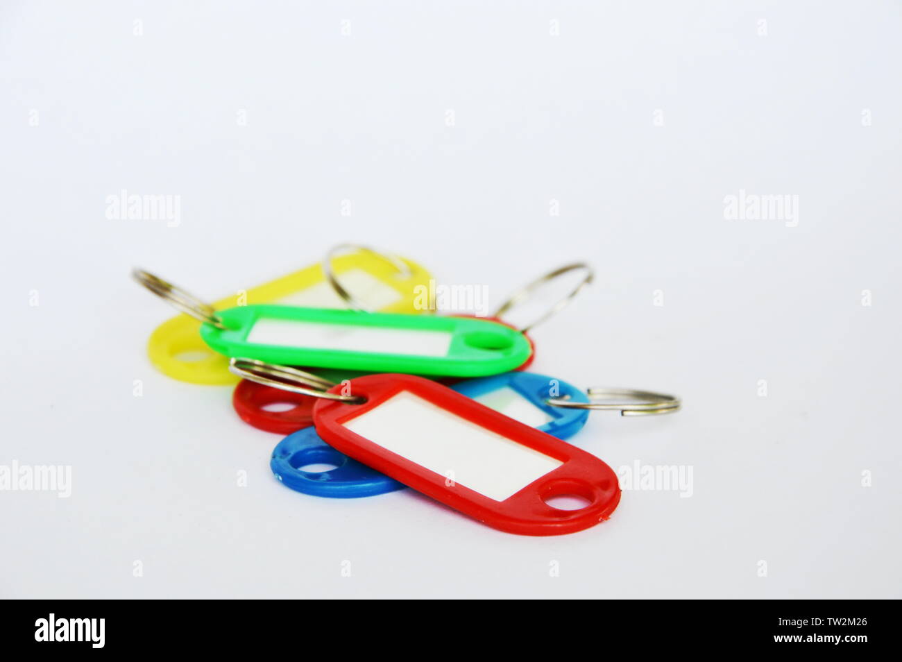 colorful plastic name tag on white background Stock Photo - Alamy