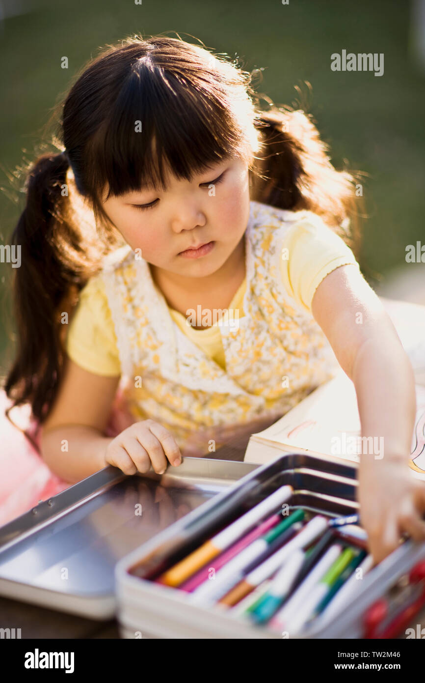 Young girl coloring Stock Photo - Alamy