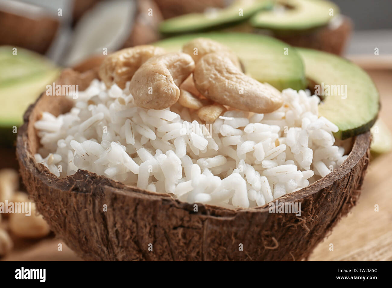 Tasty rice in coconut shell, closeup Stock Photo - Alamy