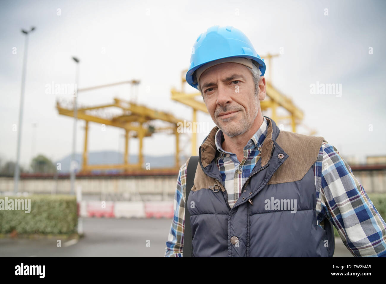 Construction worker on industrial sight looking at camera Stock Photo ...