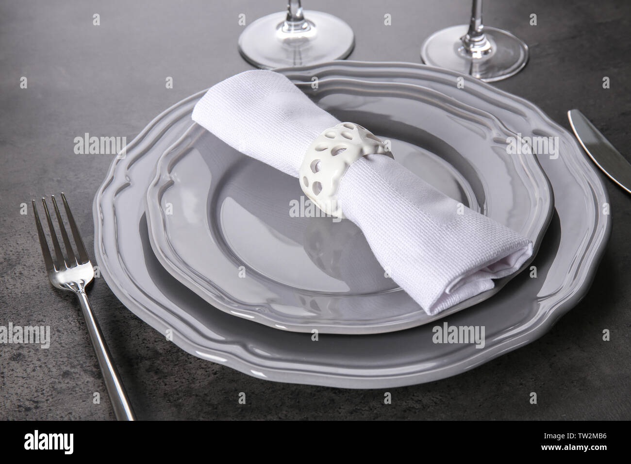 Table setting with plates and cutlery, closeup Stock Photo - Alamy