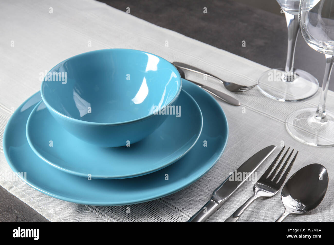 Table setting with plates and cutlery, closeup Stock Photo - Alamy