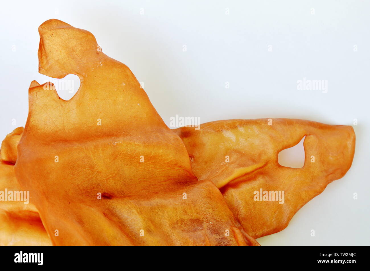 dried cow ear on white background Stock Photo - Alamy