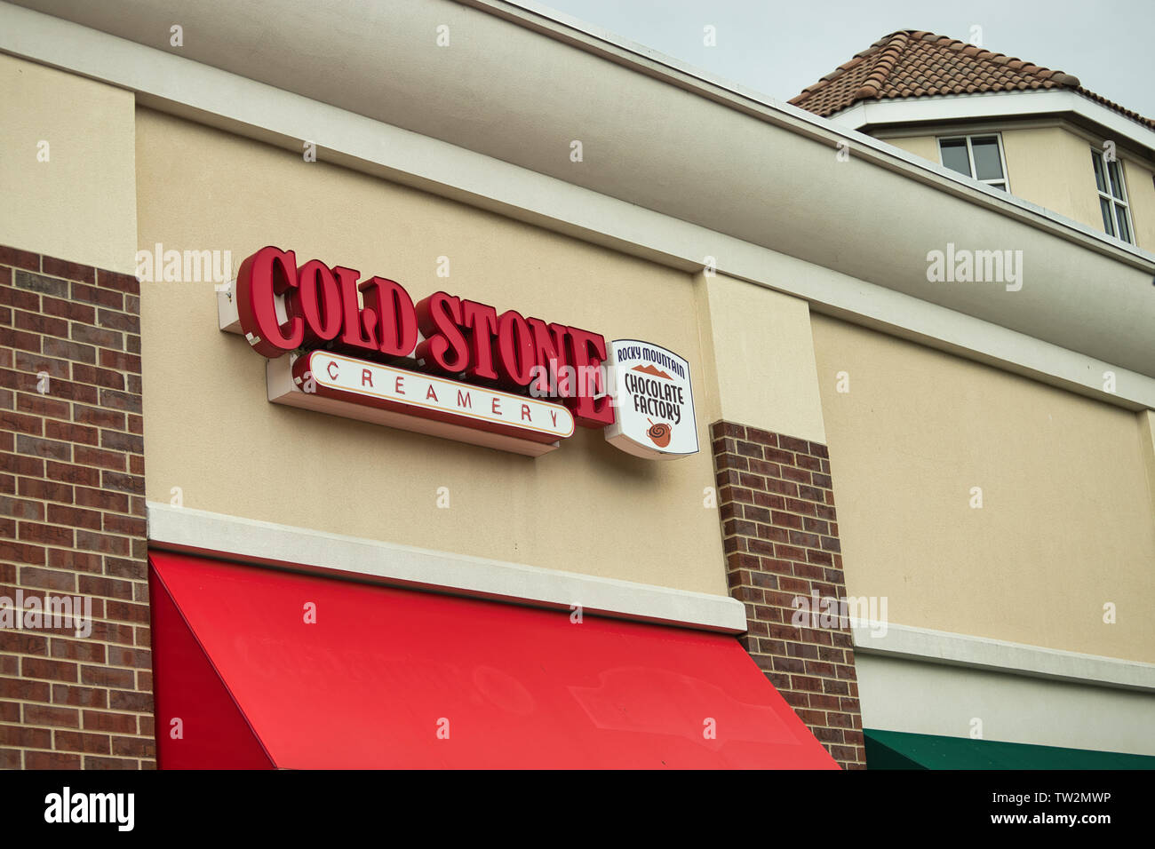 Storefront sign with some sky and clouds. June 2019. Southern Indiana ...