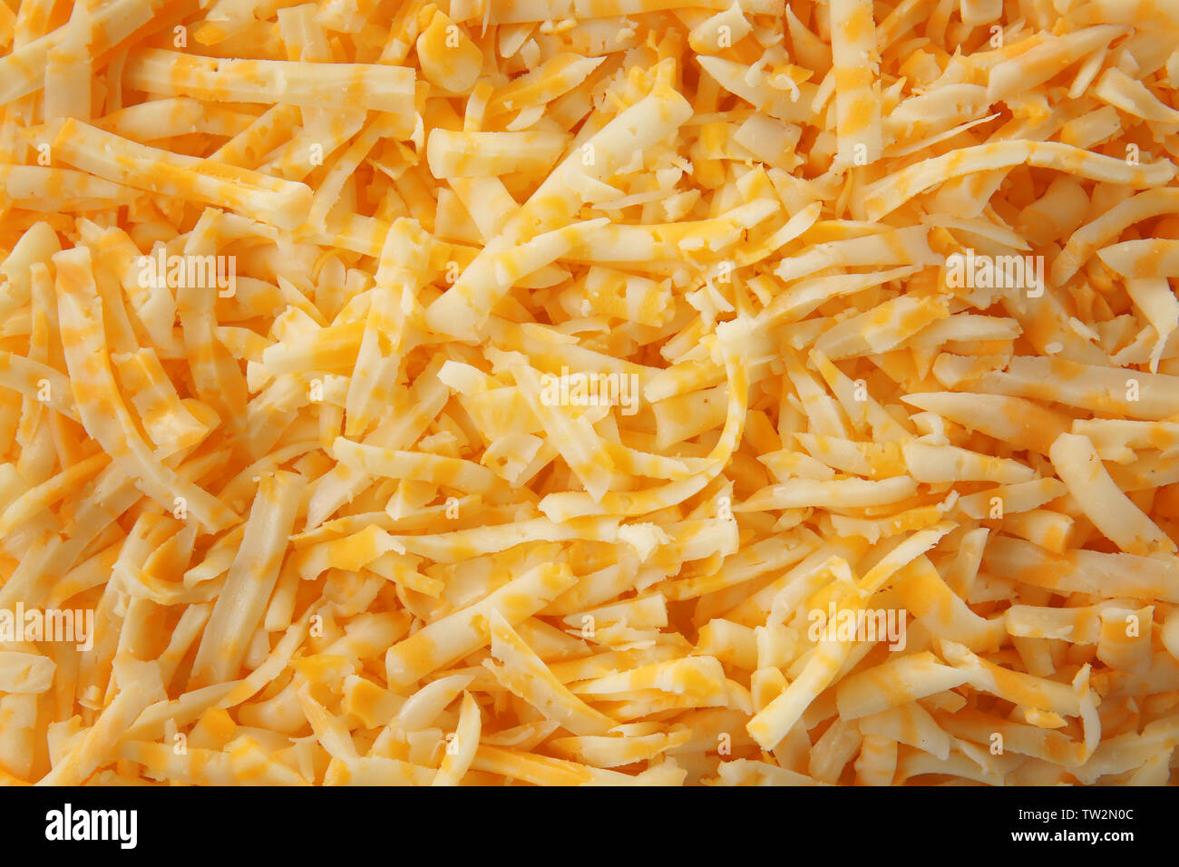 Grated cheese background Stock Photo - Alamy