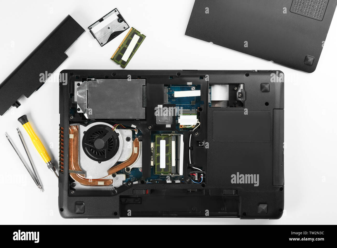 Dismantled laptop and tools on white background. Concept of computer ...