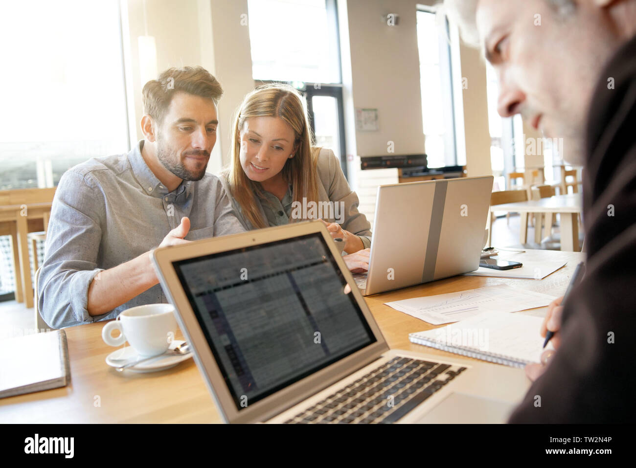 Mixed sales team working through presentation before meeting Stock ...