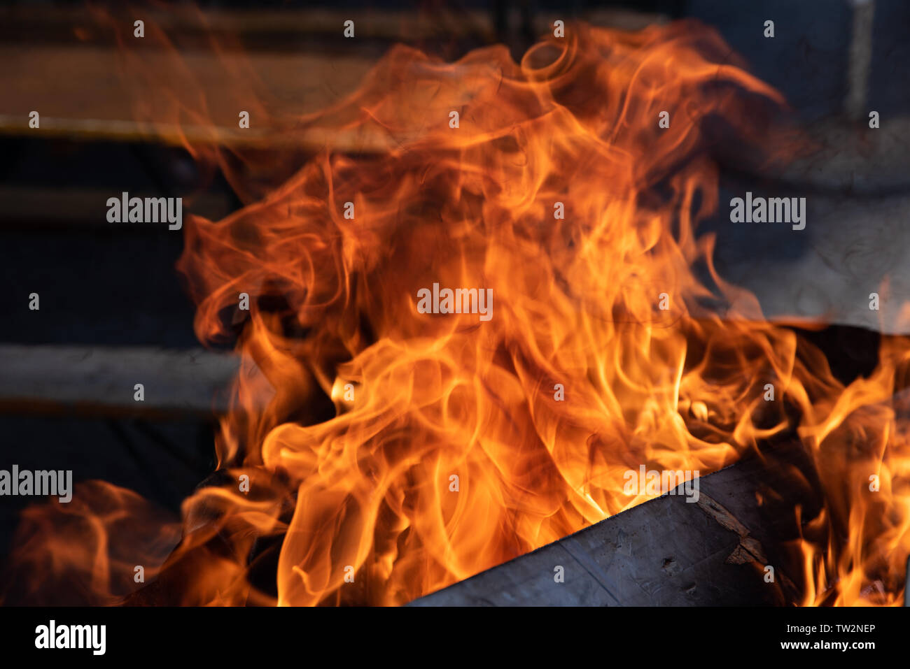 fire burnig small wood boards burning in a grill Stock Photo - Alamy