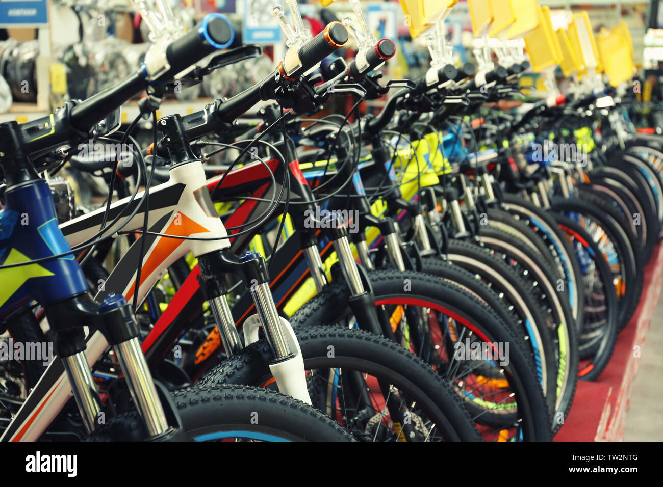 Many different bicycles indoors, closeup Stock Photo - Alamy