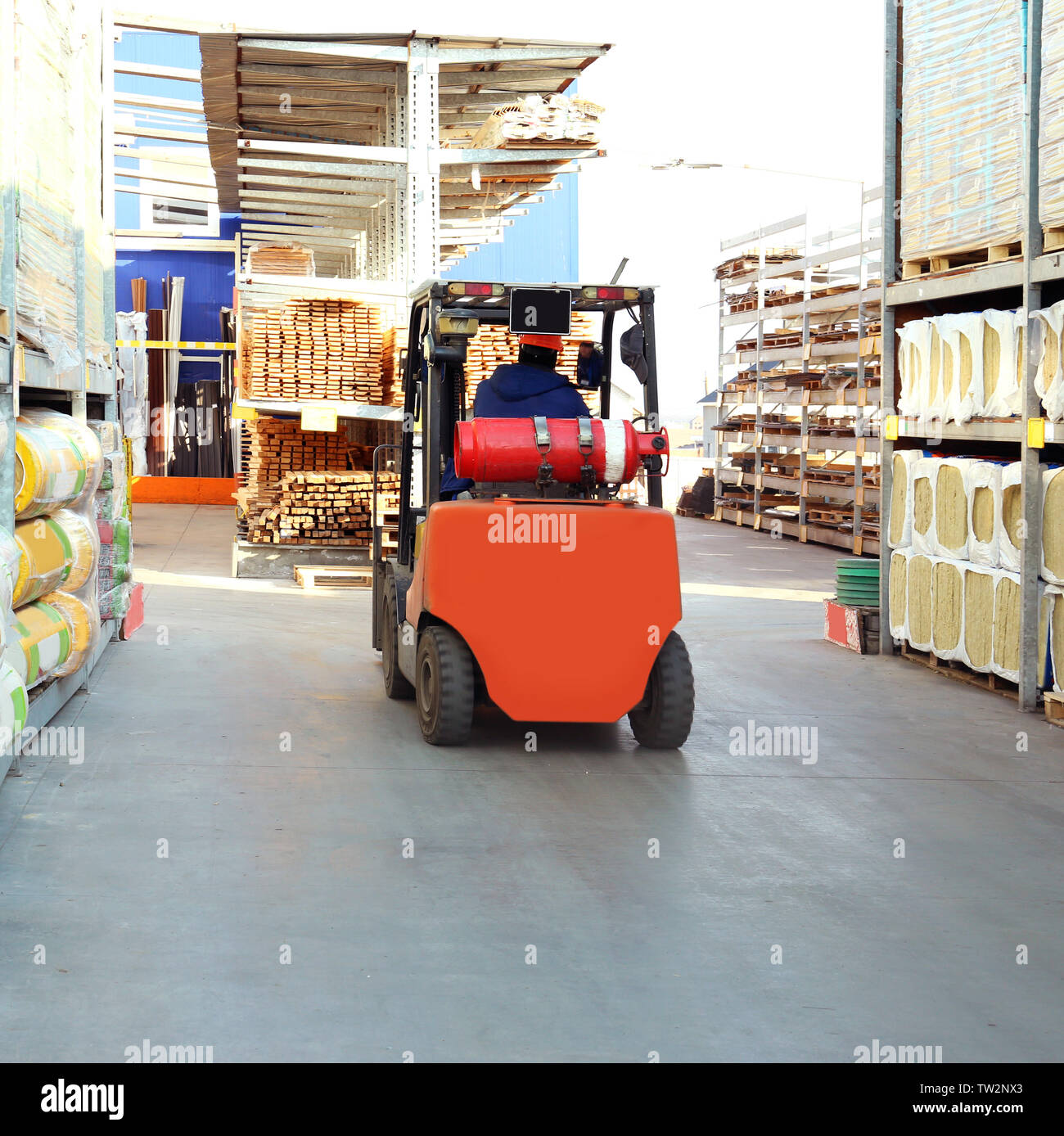 Stacking truck in wholesale warehouse Stock Photo - Alamy