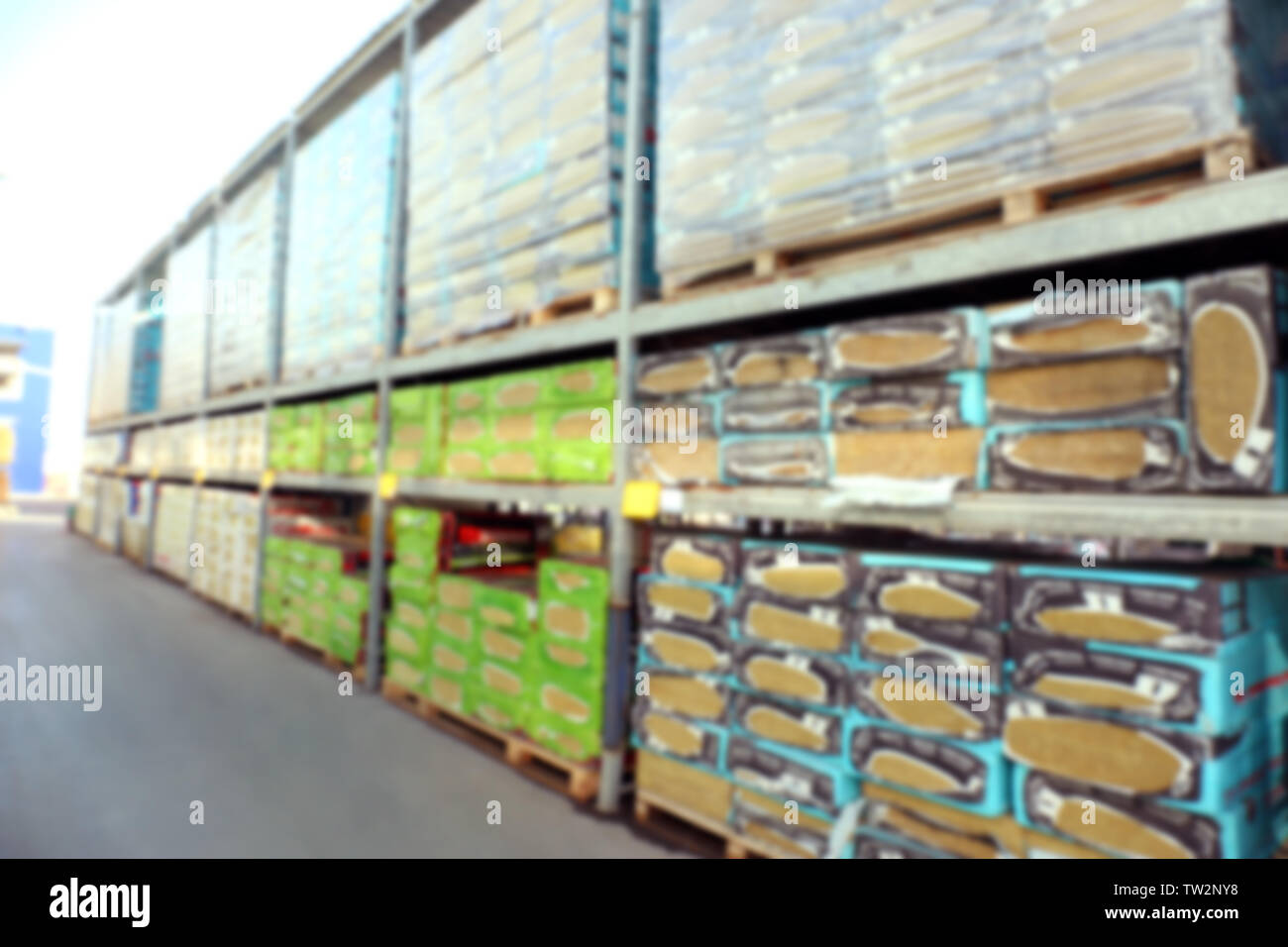 Packs with goods for wholesale distribution outdoors, blurred view ...