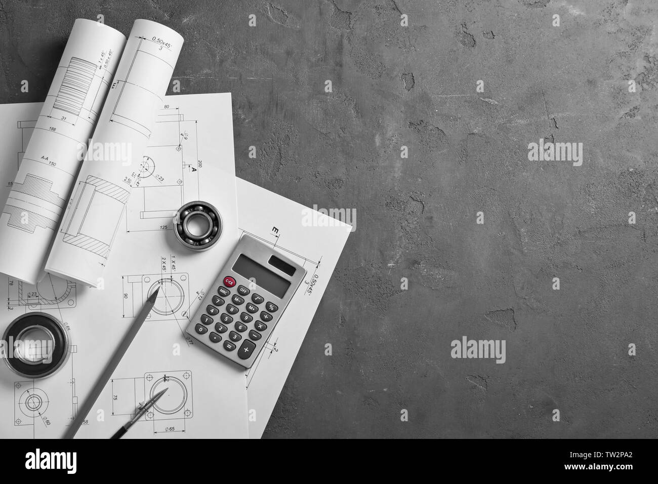 Engineering supplies and part blueprints on workplace Stock Photo - Alamy