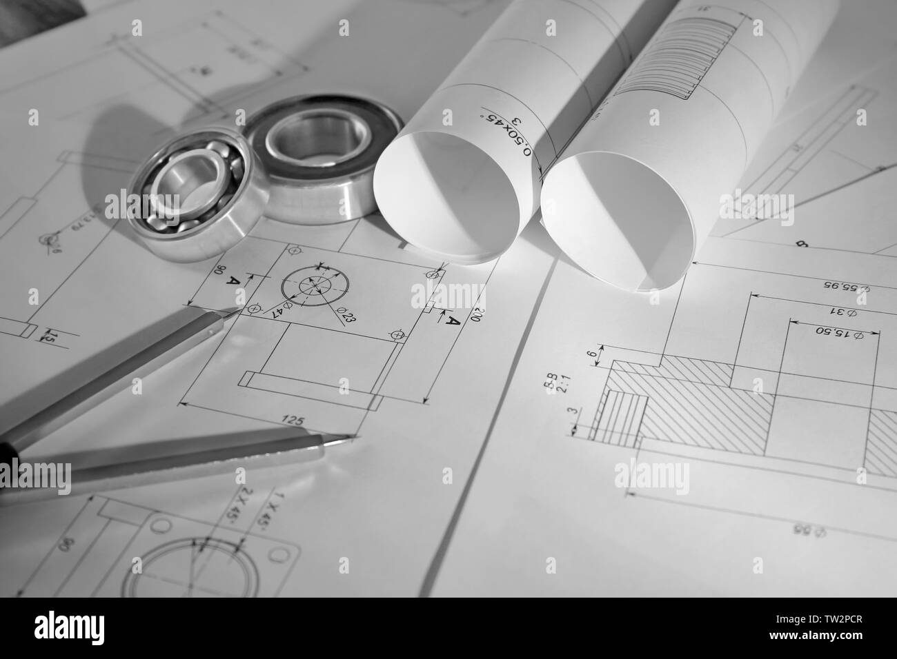 Engineering supplies and part blueprints on workplace Stock Photo - Alamy