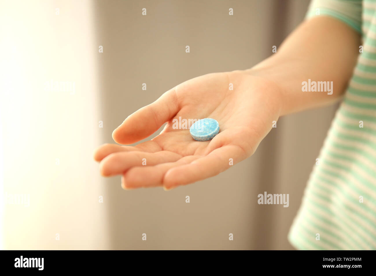 Female hand with rat poison on blurred background Stock Photo - Alamy