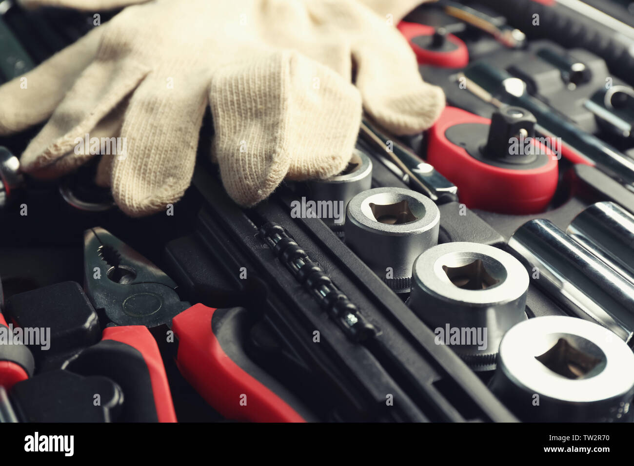 Gloves and toolbox, closeup Stock Photo - Alamy